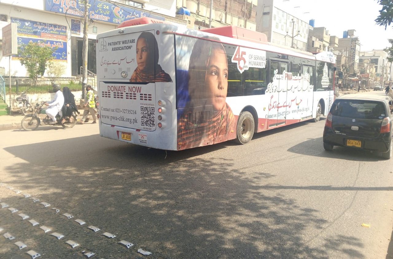 Red Bus advertising in Karachi | Bus Branding | Artavia